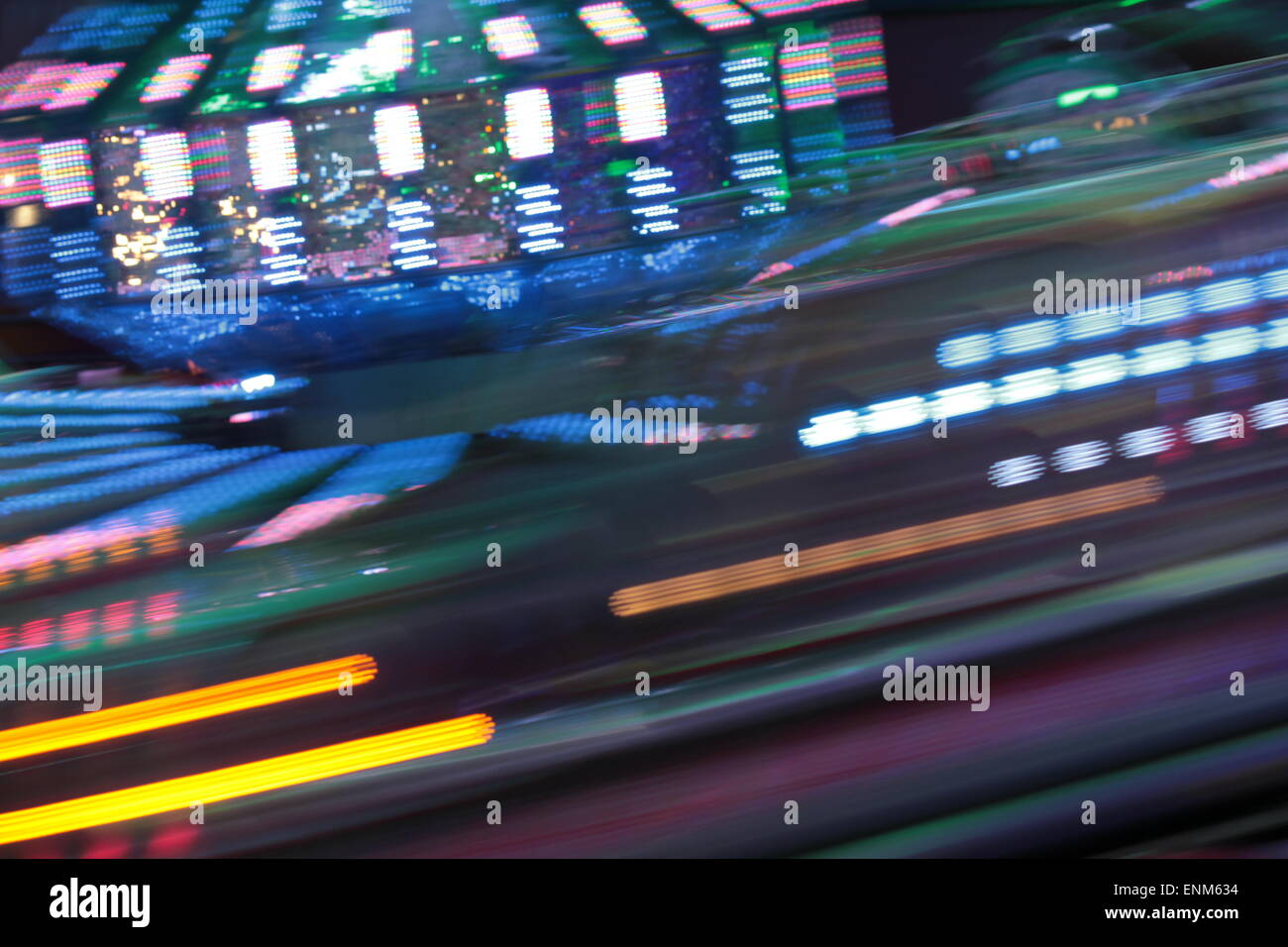 fairground funfair ride moving fast fair lights Night colours of the ...