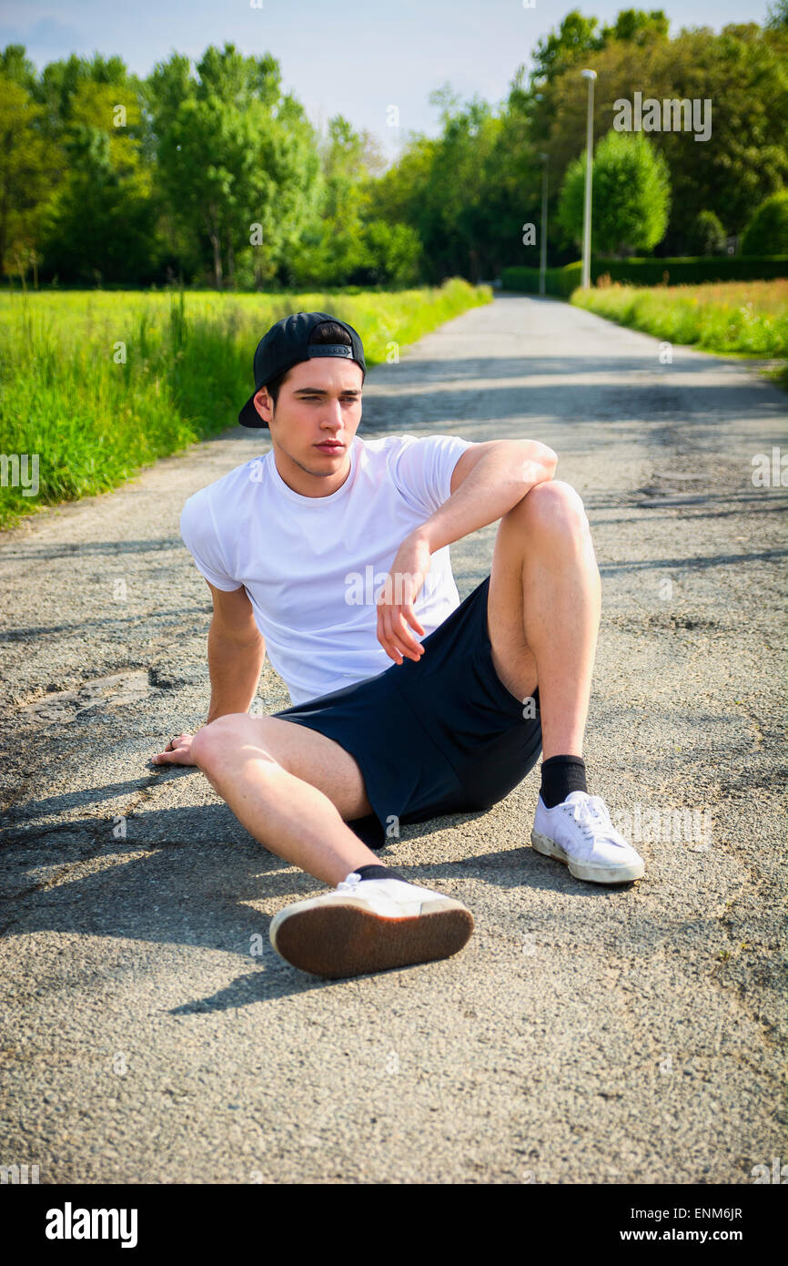 Handsome sportsman sitting on hi-res stock photography and images - Alamy