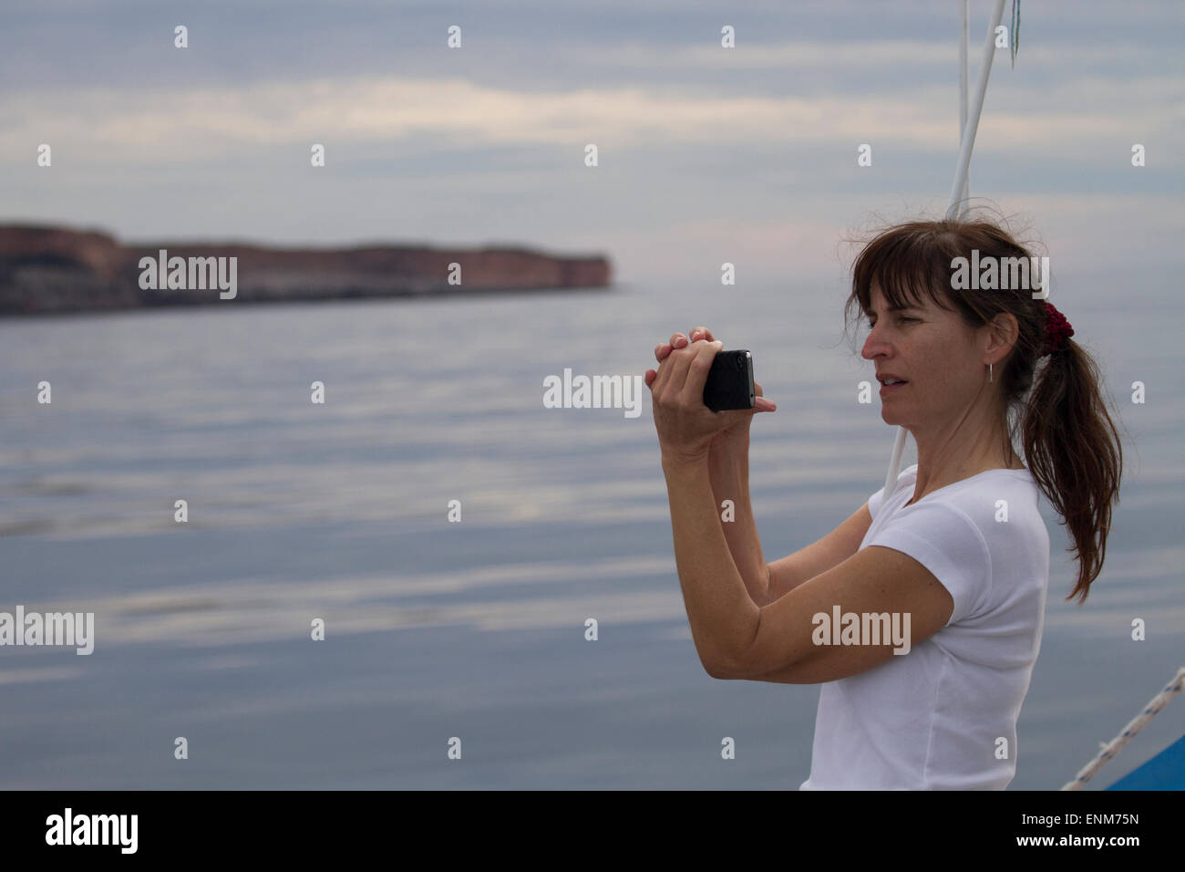 Woman using phone camera Stock Photo - Alamy