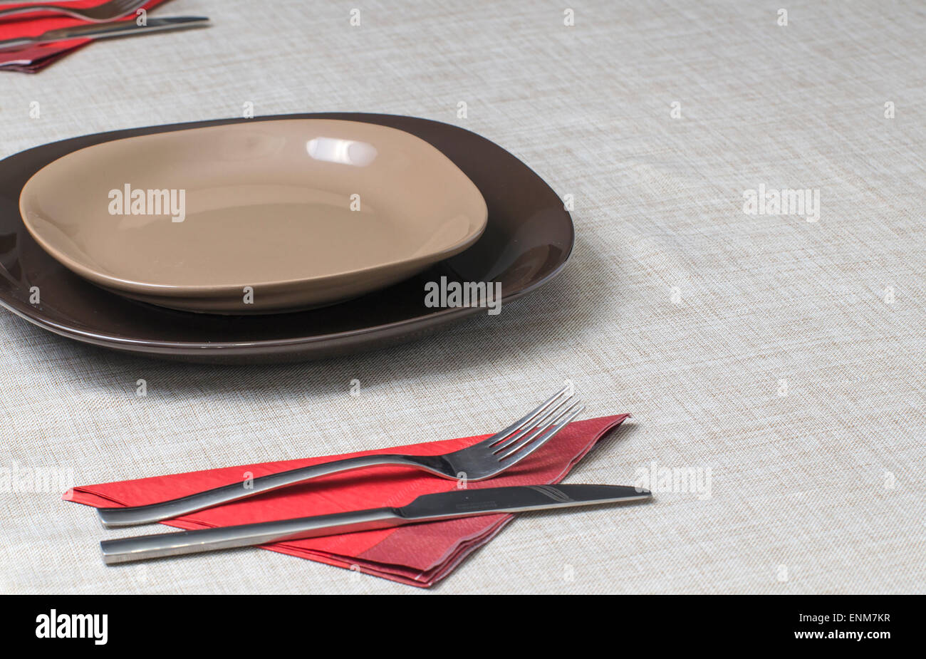 Dining table with cutlery and dishes Stock Photo - Alamy