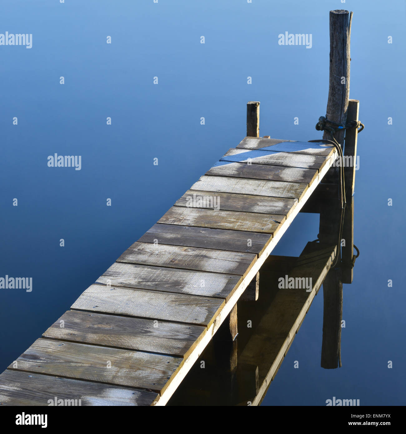 Landscape with jetty on lake Stock Photo - Alamy