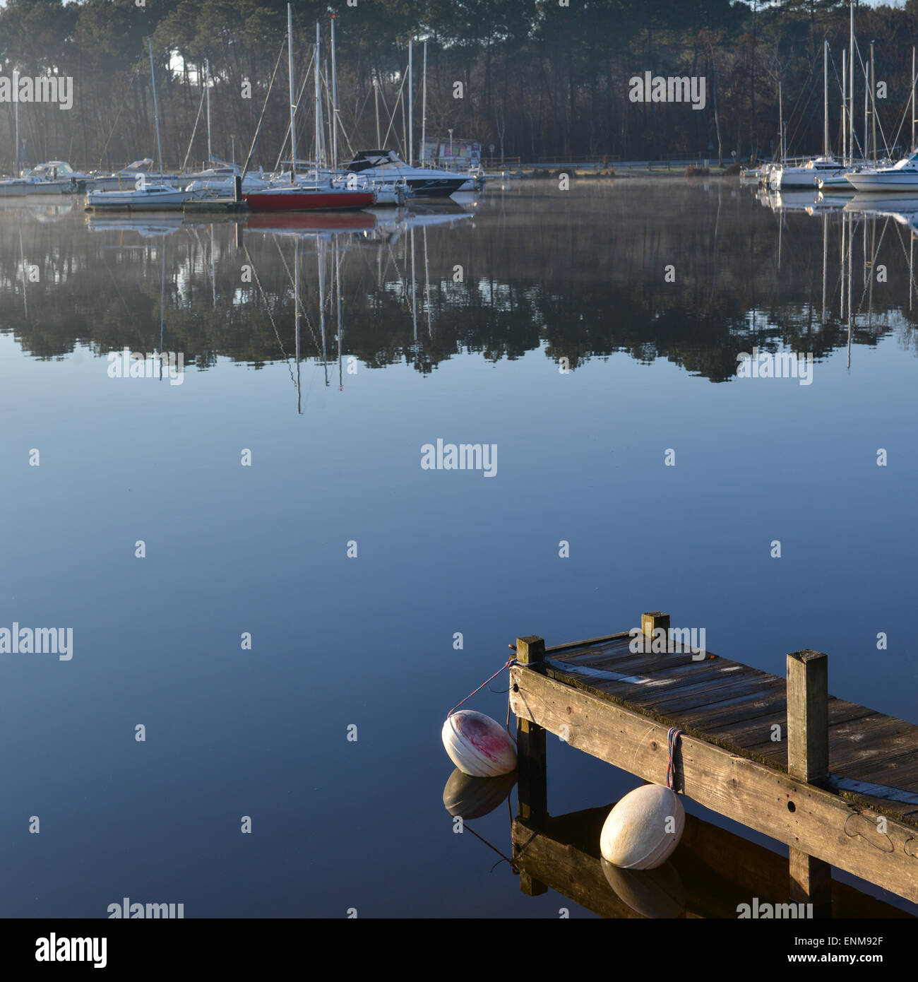 Landscape with jetty on lake Stock Photo - Alamy