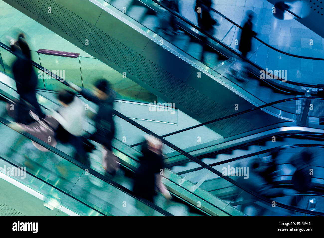 People moving on modern escalators hi-res stock photography and images ...