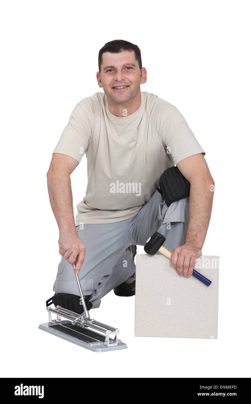 Installing floor tile Cut Out Stock Images & Pictures - Alamy