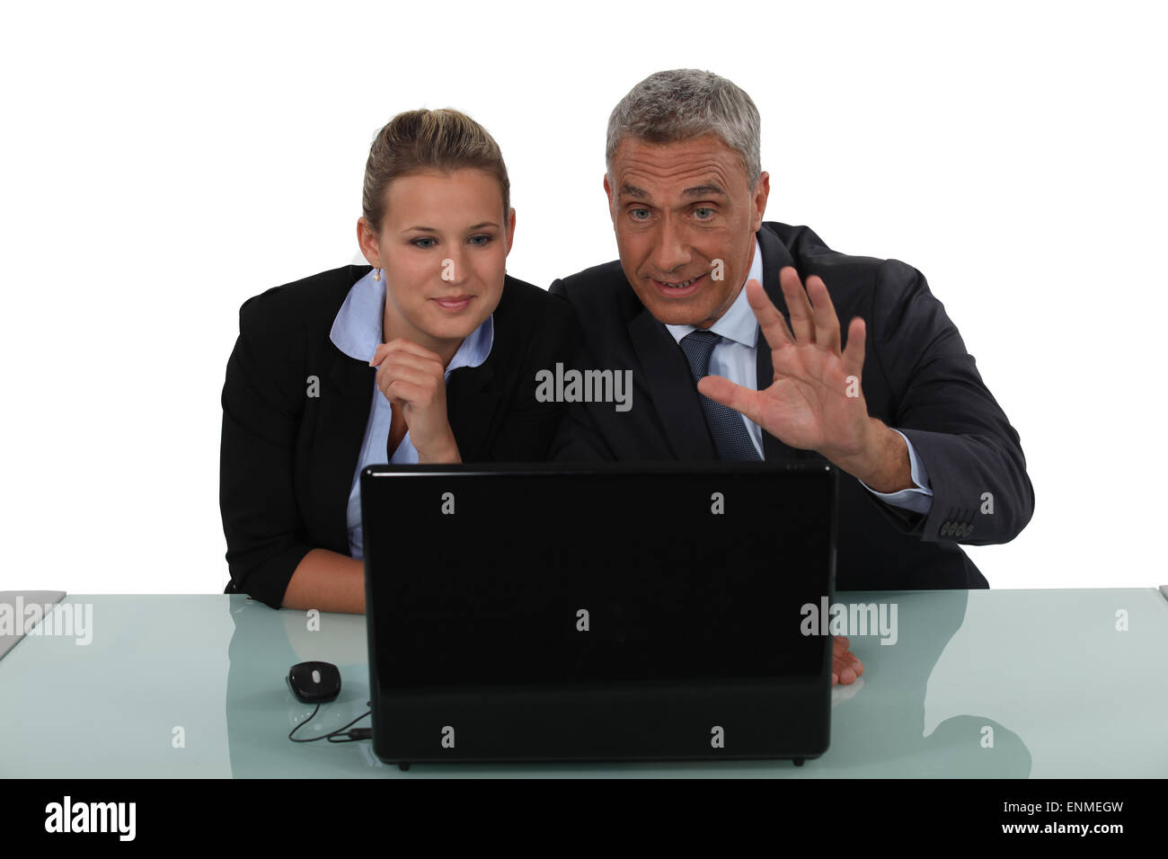 Workers in front of computer Stock Photo - Alamy