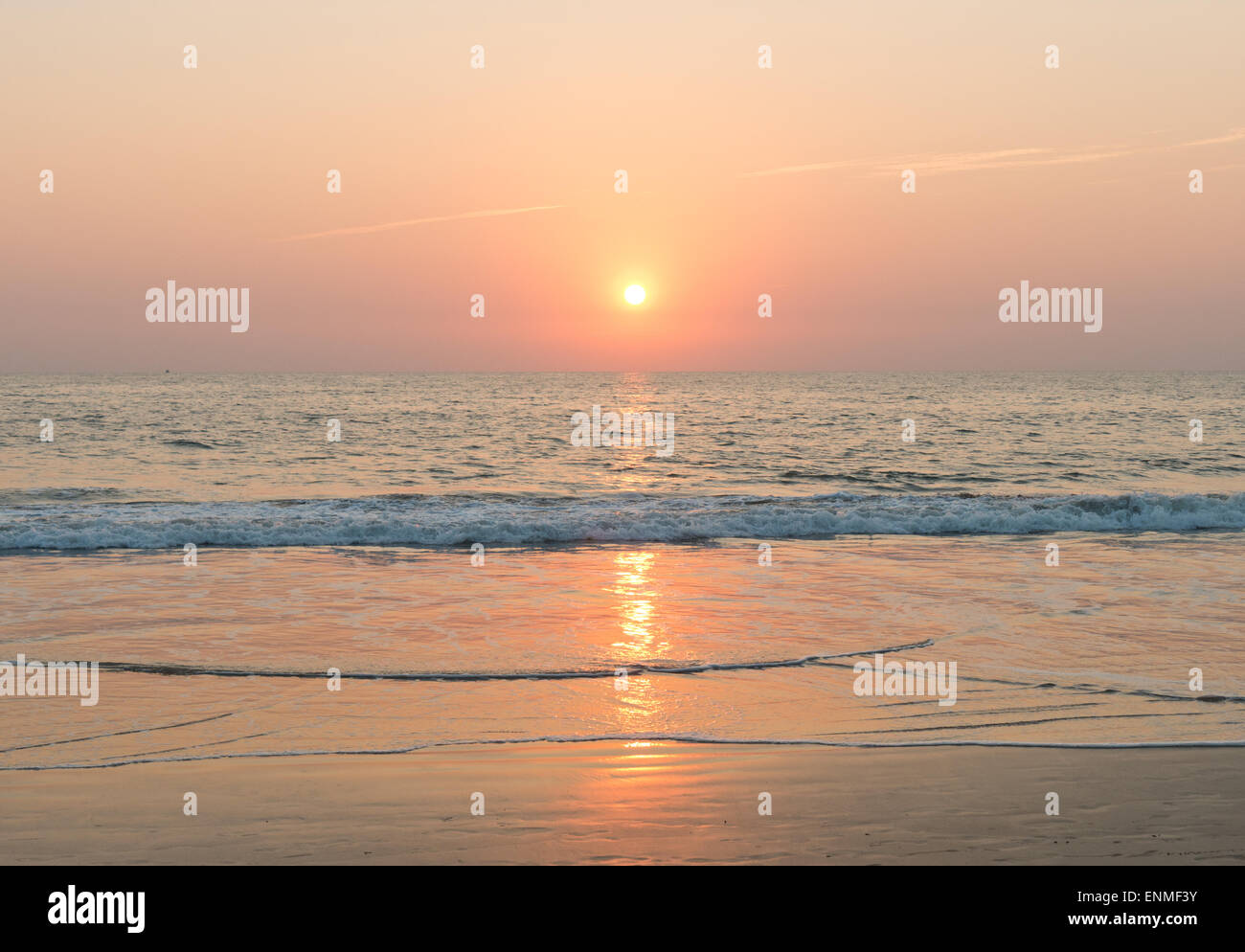 A beach at sunset Stock Photo - Alamy