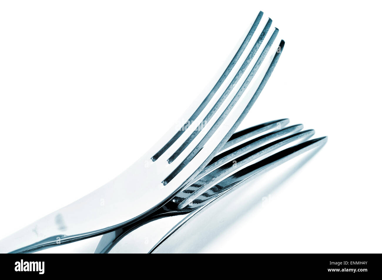 closeup of a pair of forks on a white background Stock Photo - Alamy