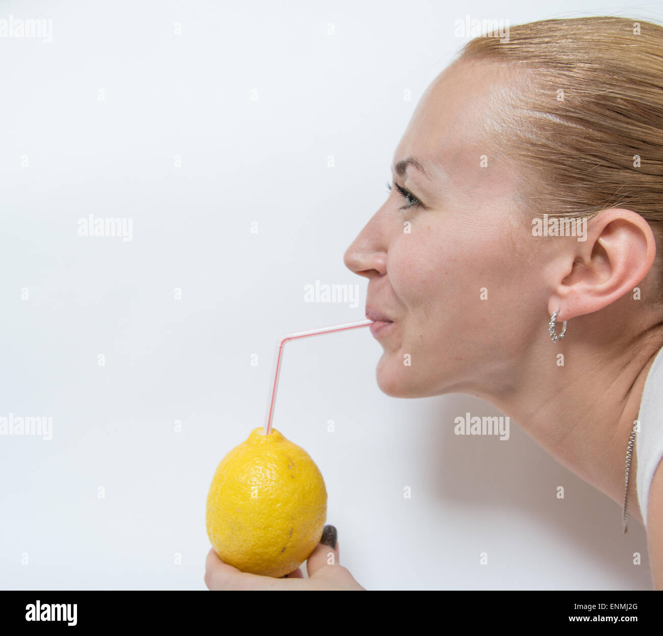 girl drinks lemon Stock Photo - Alamy