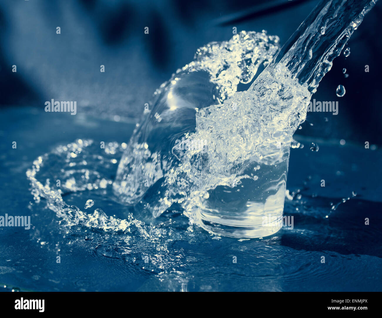 Splash water from glass Stock Photo - Alamy