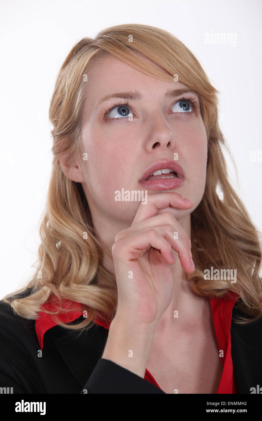 Horrified woman looking up at the sky Stock Photo - Alamy