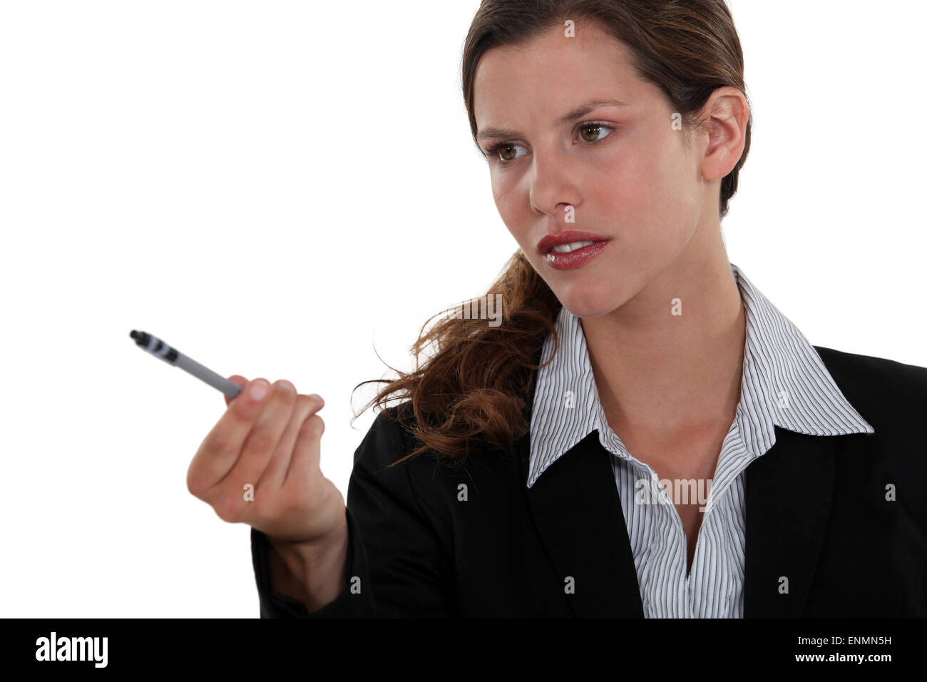 Woman pointing her pen Stock Photo - Alamy
