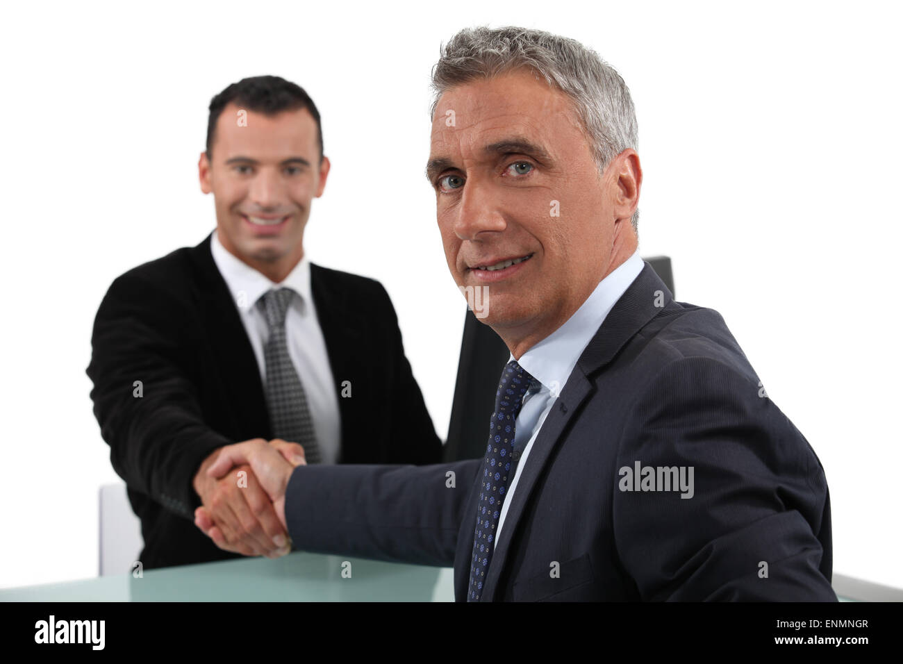 Businessmen shaking hands Stock Photo - Alamy