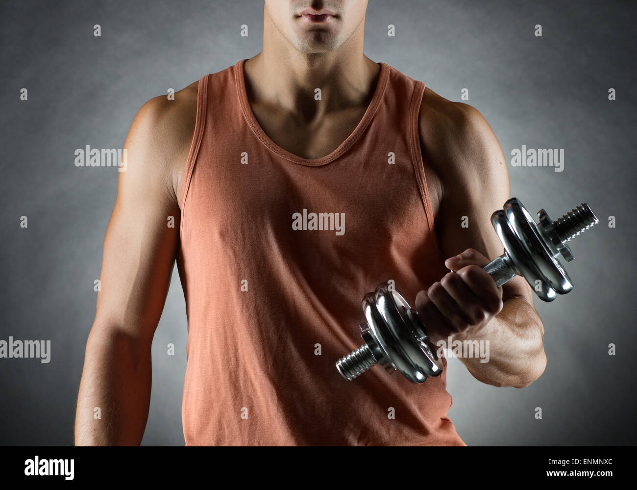 young man with dumbbell Stock Photo - Alamy