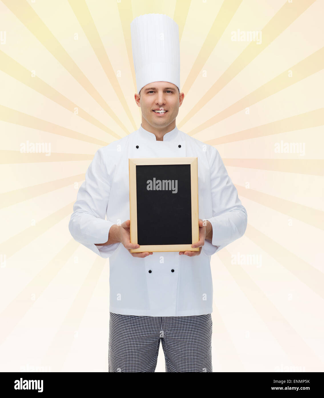 happy male chef cook holding blank menu board Stock Photo - Alamy