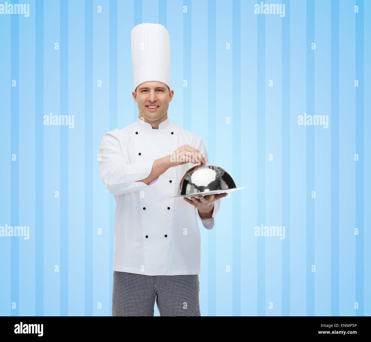 happy male chef cook holding cloche Stock Photo - Alamy