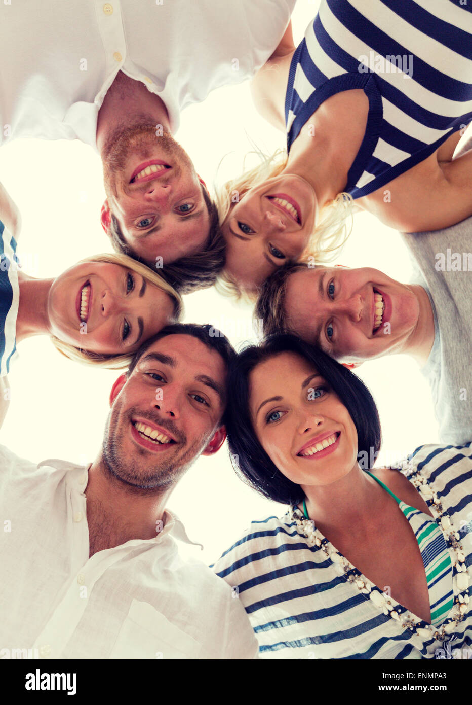 smiling friends in circle Stock Photo - Alamy