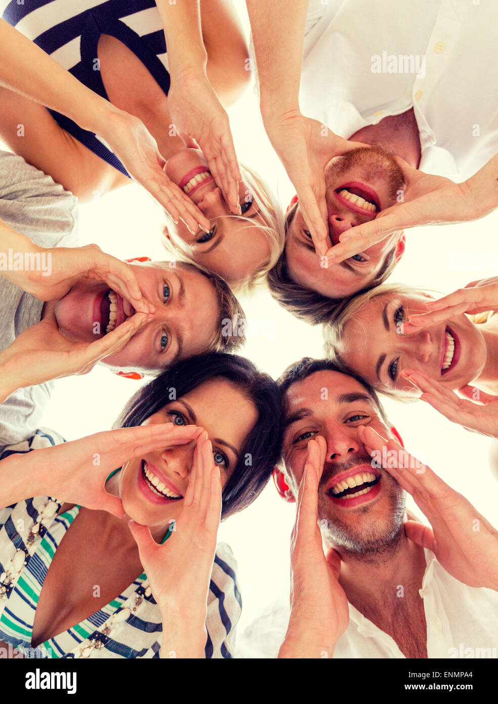 smiling friends in circle Stock Photo - Alamy