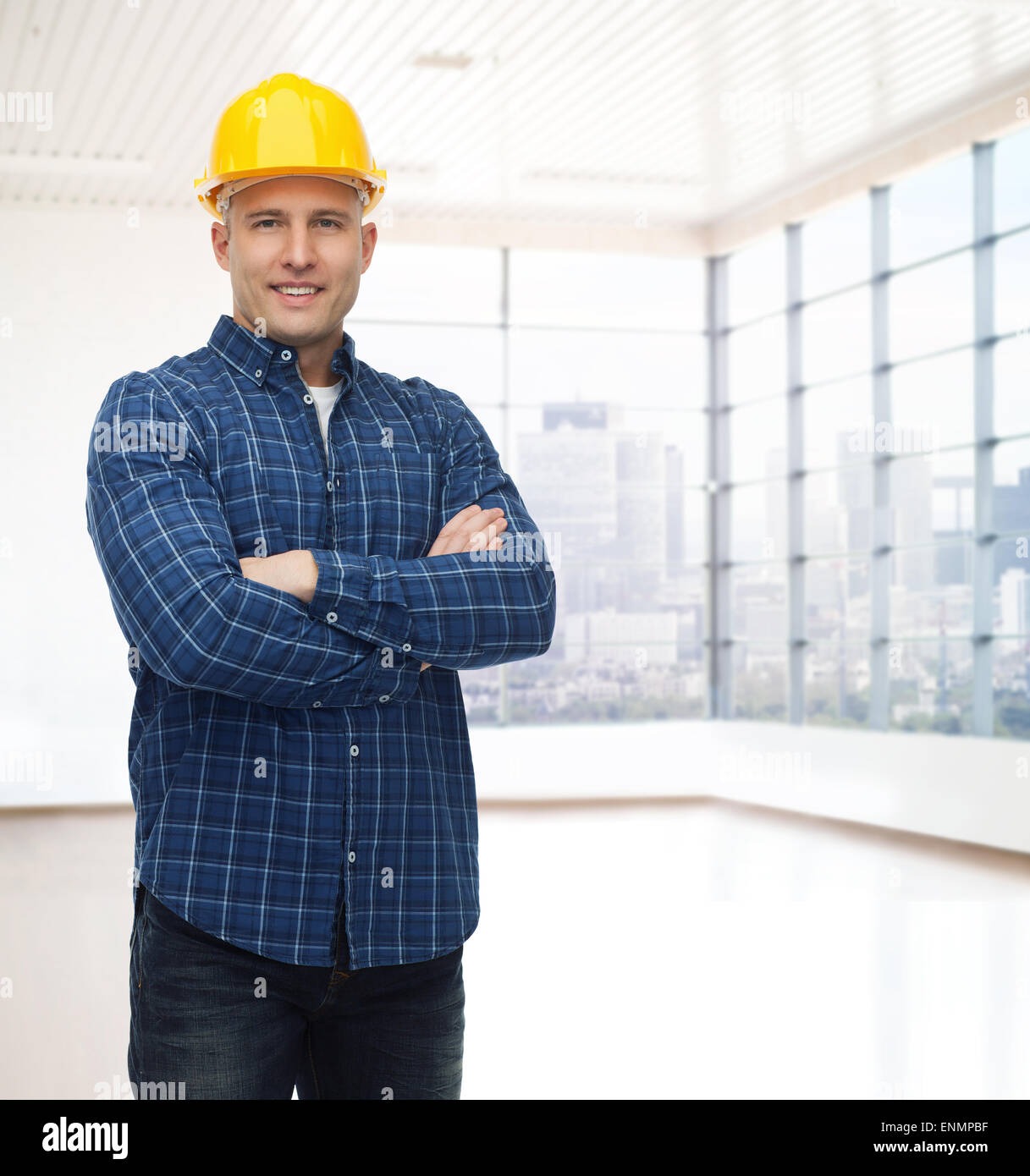 smiling male builder or manual worker in helmet Stock Photo - Alamy