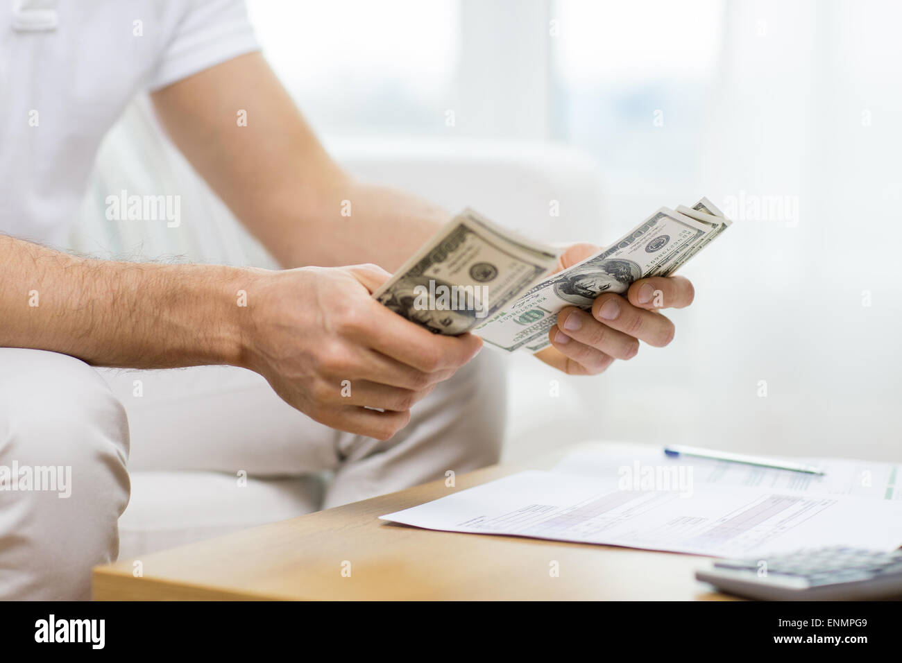close up of man hands counting money at home Stock Photo - Alamy