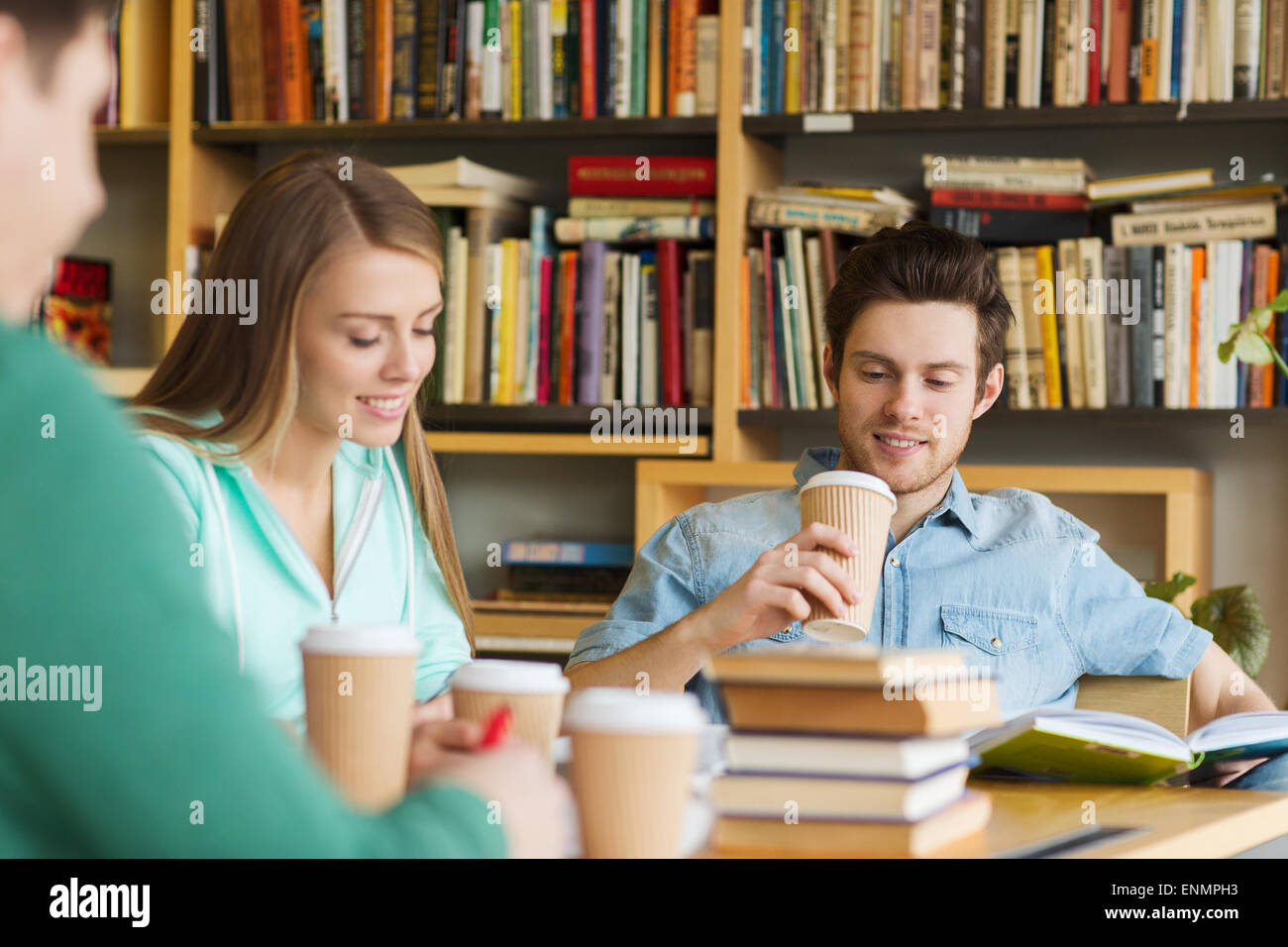 students reading and drinking coffee in library Stock Photo - Alamy