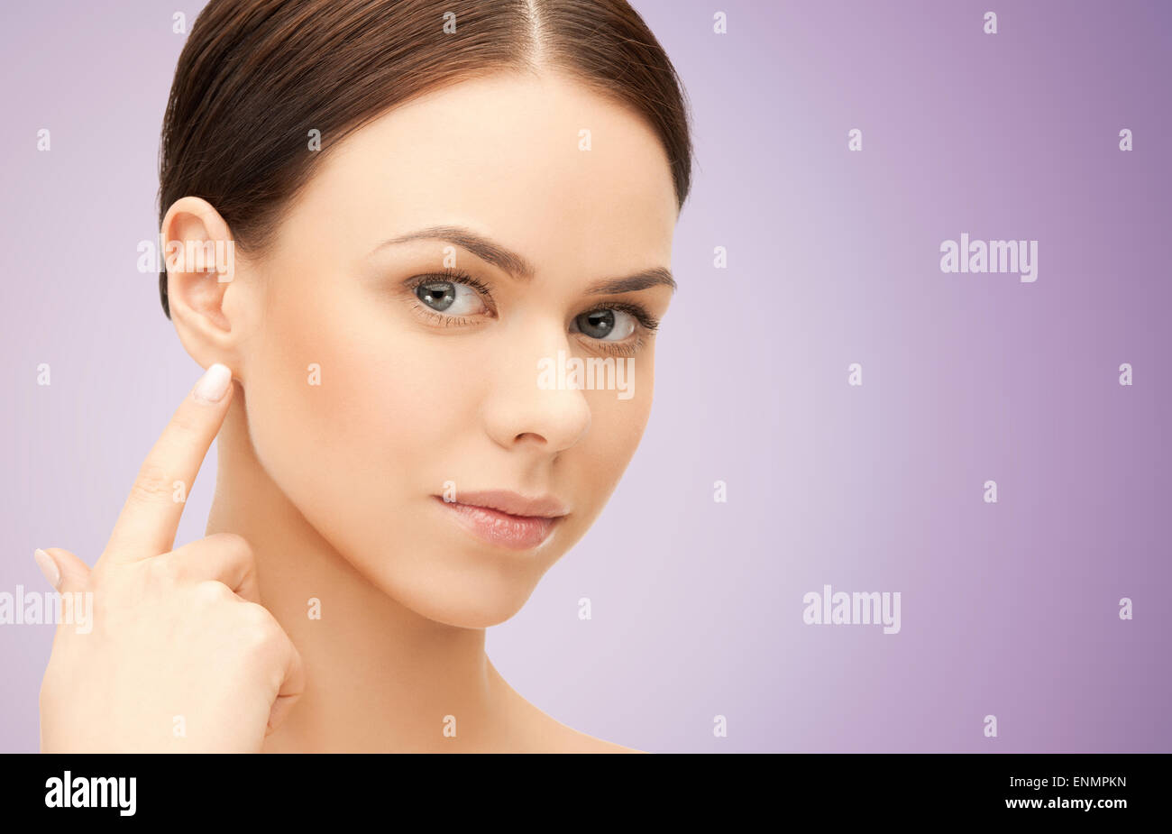 face of beautiful woman touching her ear Stock Photo - Alamy