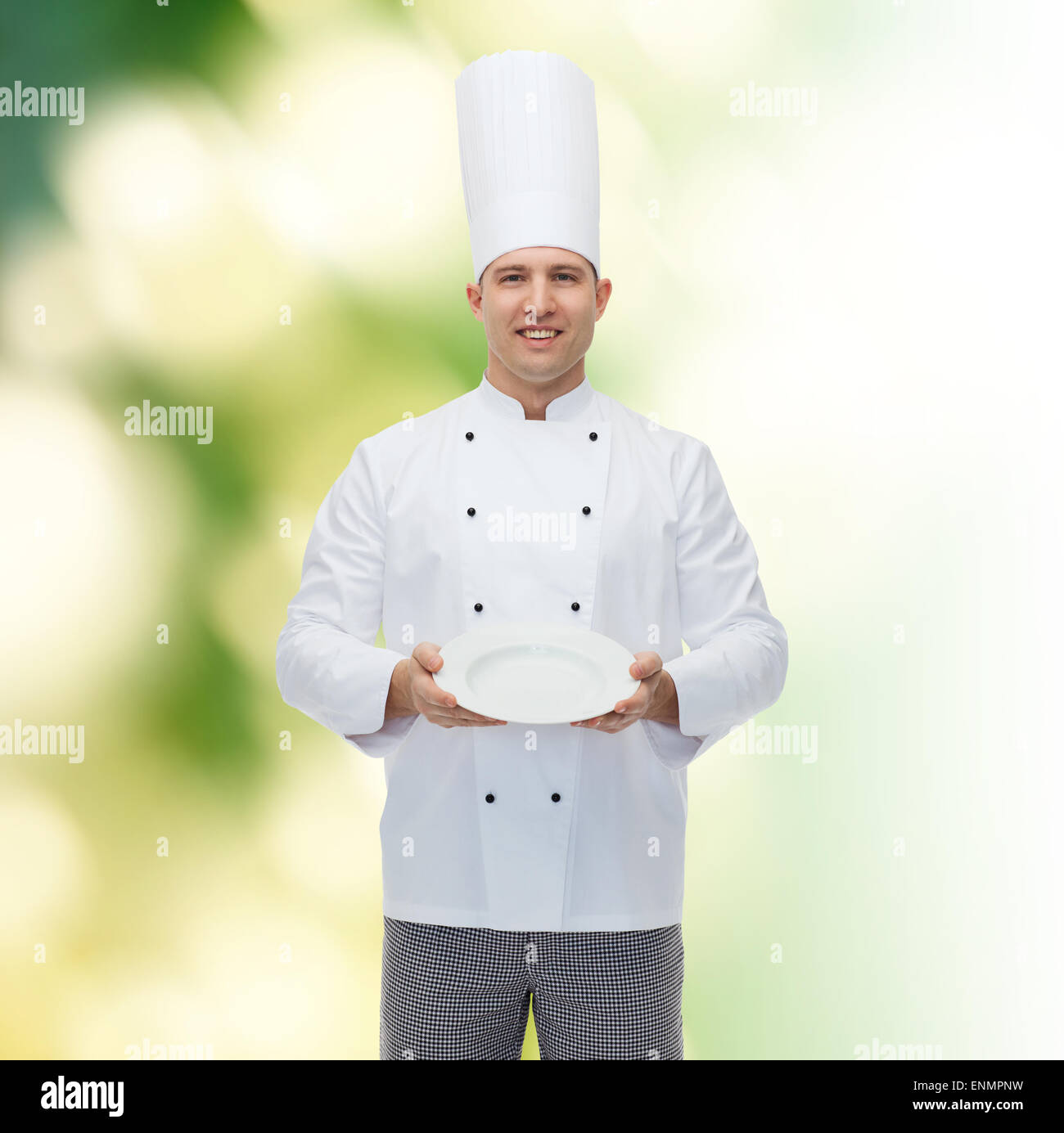 happy male chef cook showing empty plate Stock Photo - Alamy