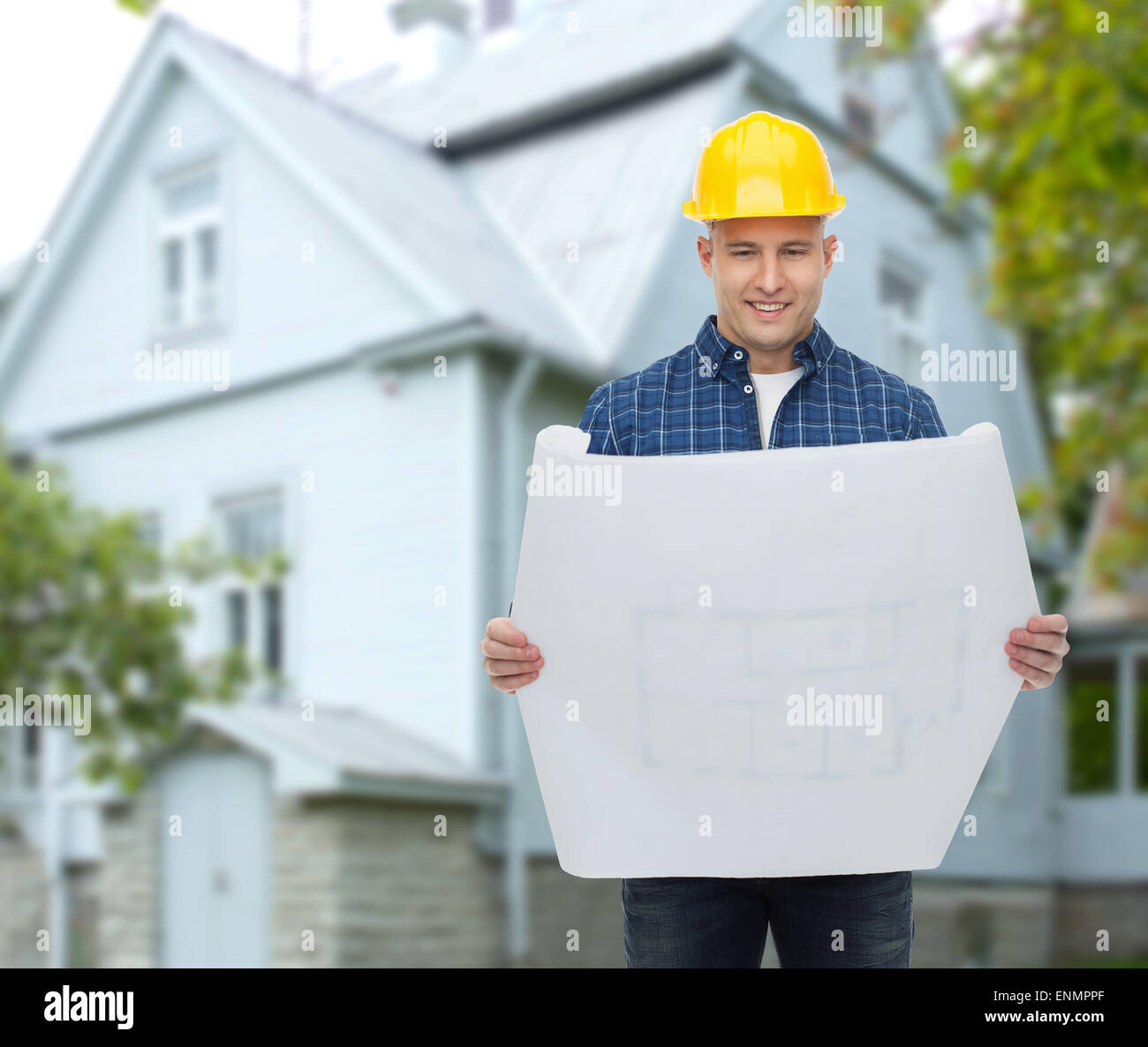 smiling builder with blueprint over house Stock Photo - Alamy