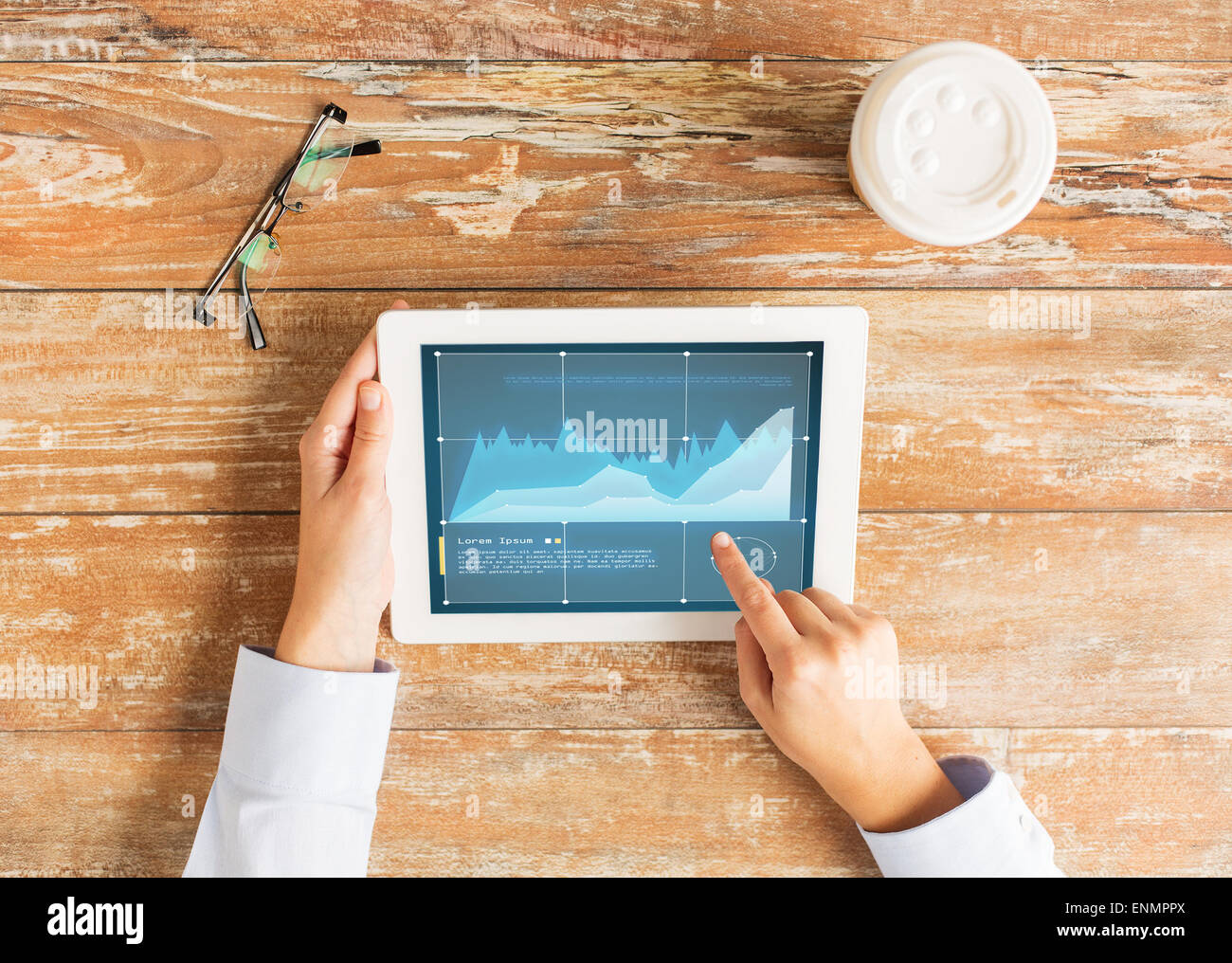 Woman holding tablet with charts hi-res stock photography and images ...