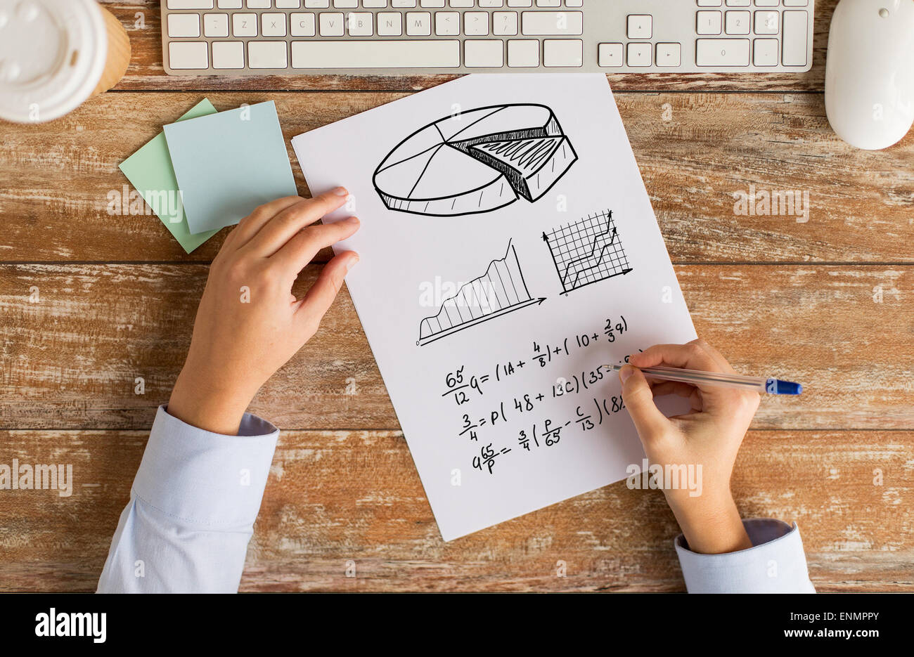 close up of hands solving task or writing equation Stock Photo - Alamy