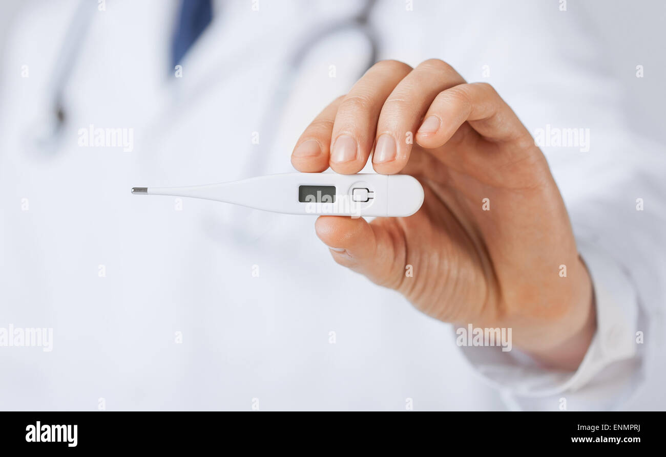 male doctor with thermometer Stock Photo - Alamy