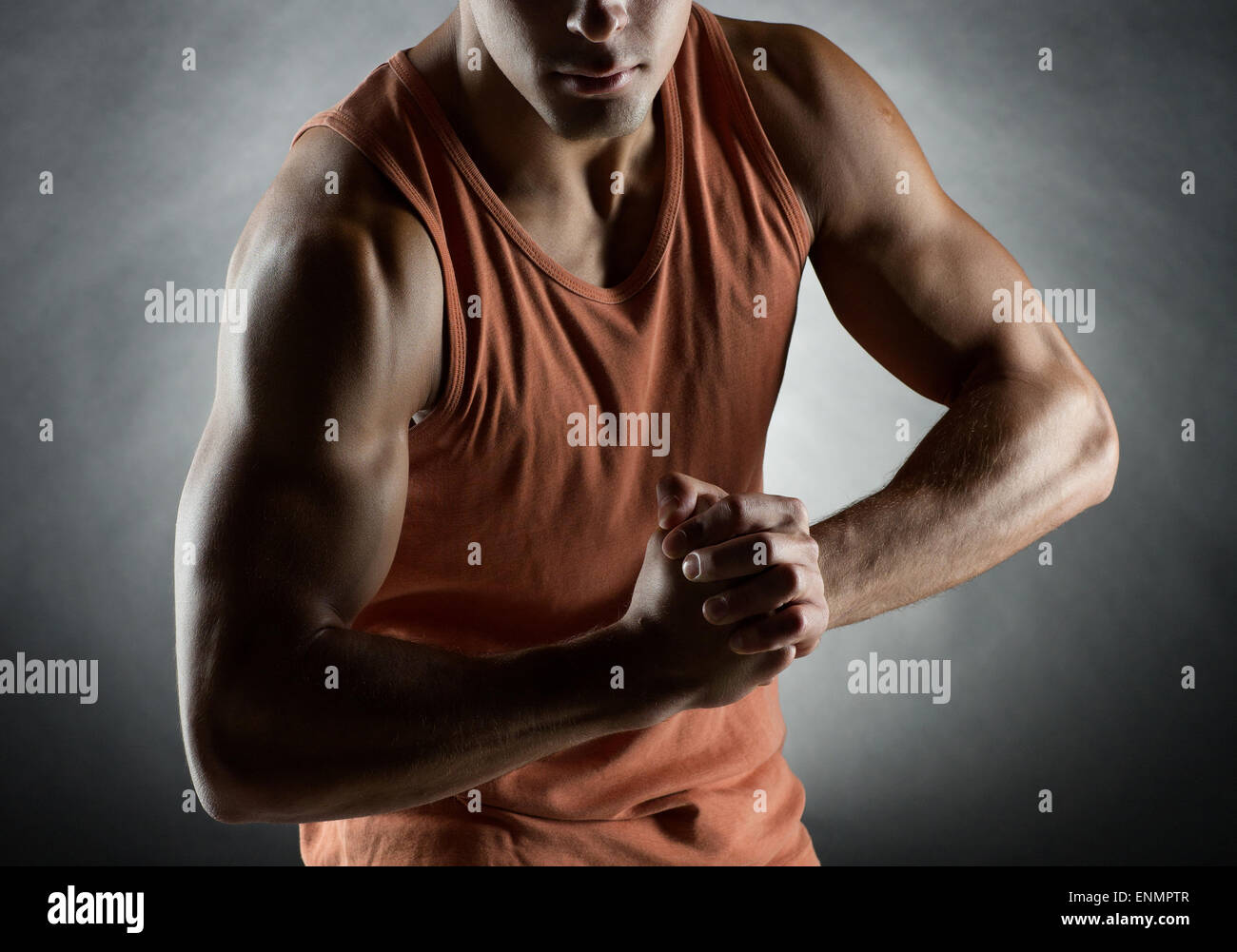 young man showing biceps Stock Photo - Alamy