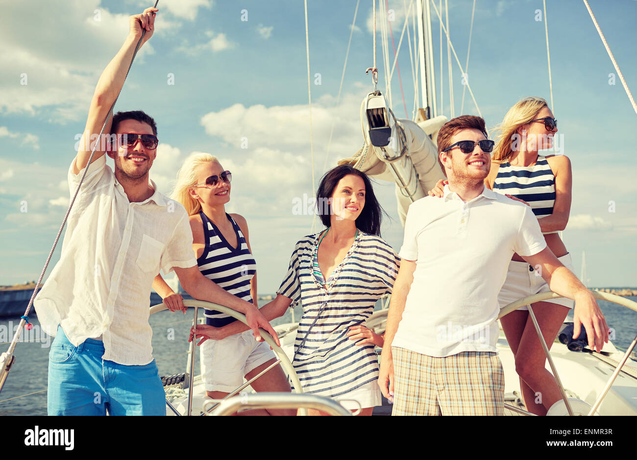 smiling friends sailing on yacht Stock Photo - Alamy