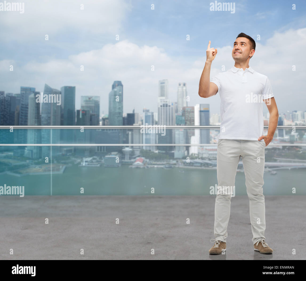 smiling man pointing finger up Stock Photo - Alamy smiling man pointing finger up Stock Photo - Alamy