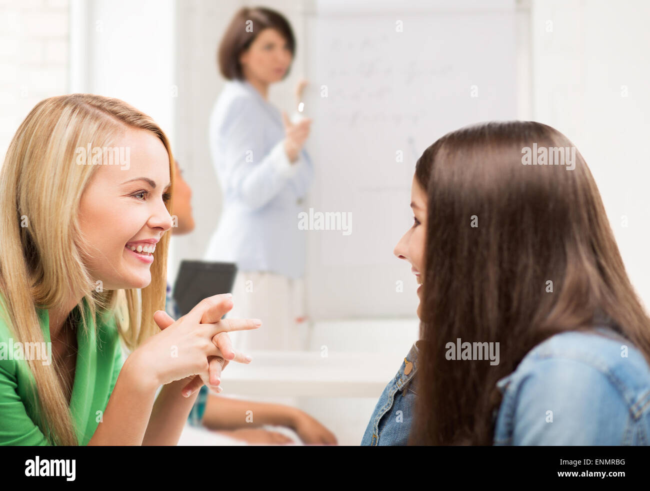 student girls gossiping at school Stock Photo - Alamy