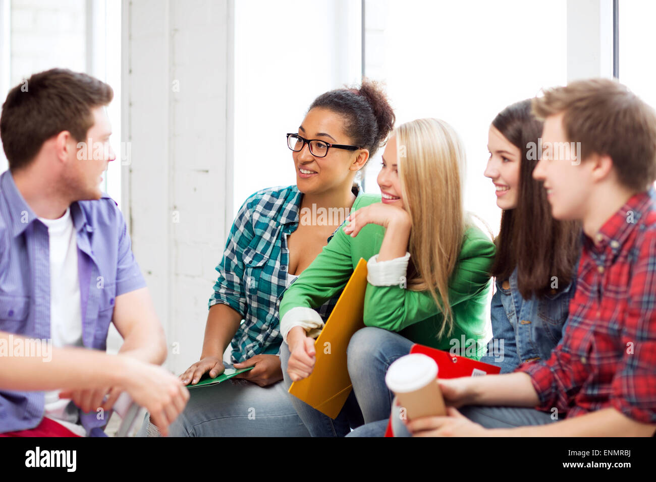 students communicating and laughing at school Stock Photo - Alamy