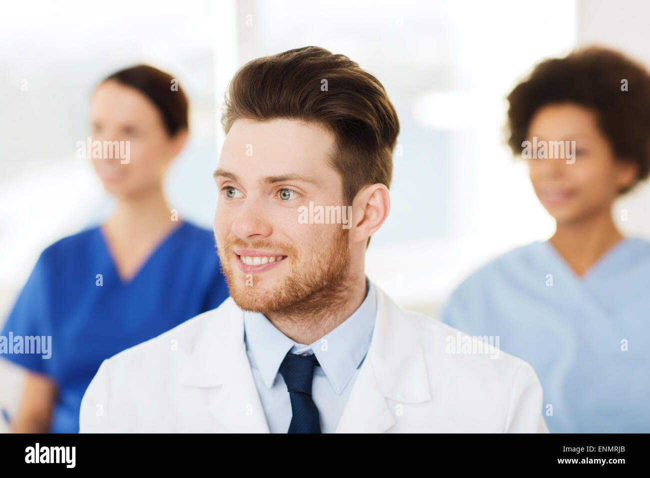happy doctor over group of medics at hospital Stock Photo - Alamy