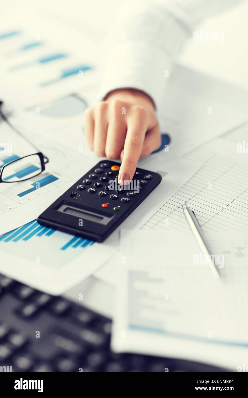 woman hand with calculator and papers Stock Photo - Alamy