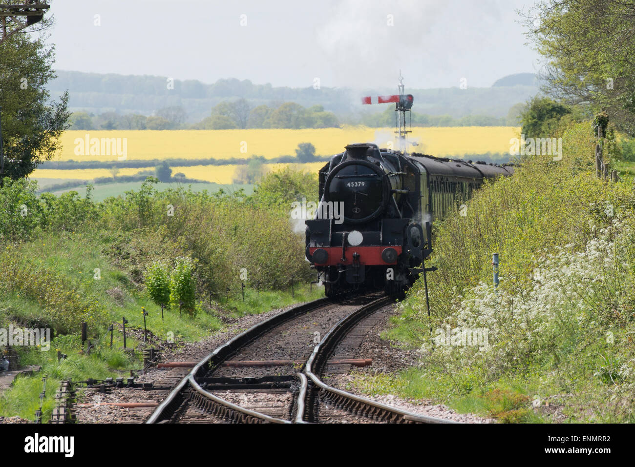 Steam train rounds approaches Ropley station on the Watercress Line ...