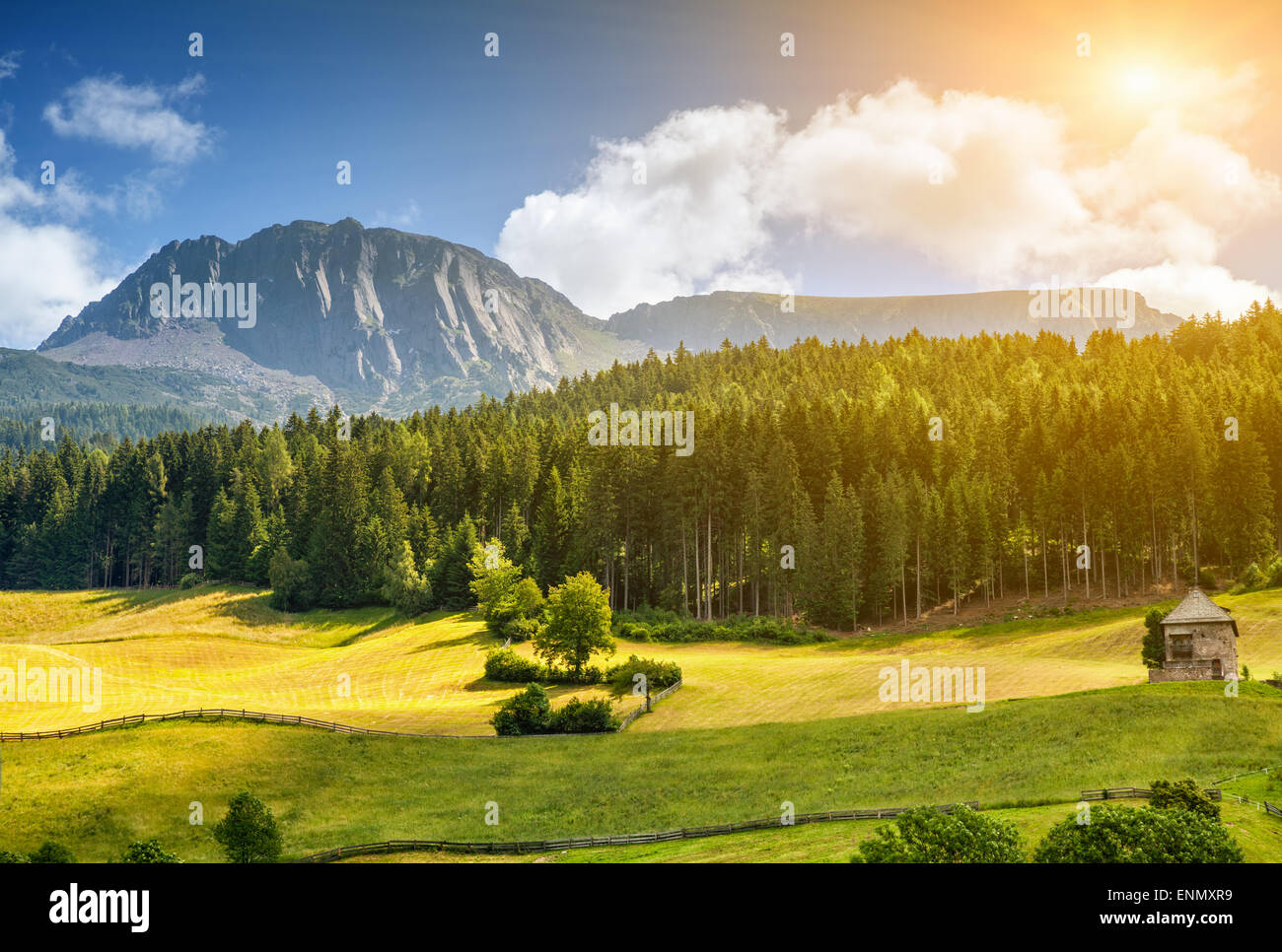 Colorful Alpine landscape scenery with sun setting down Stock Photo - Alamy