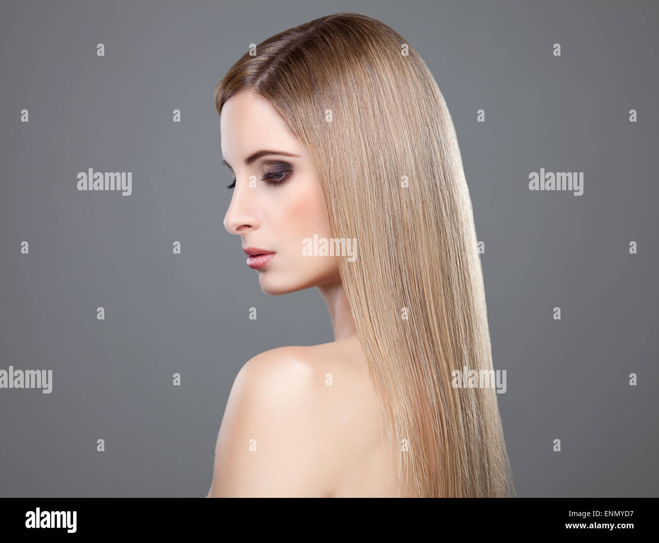 Profile of a beauty with long straight blonde hair Stock Photo - Alamy