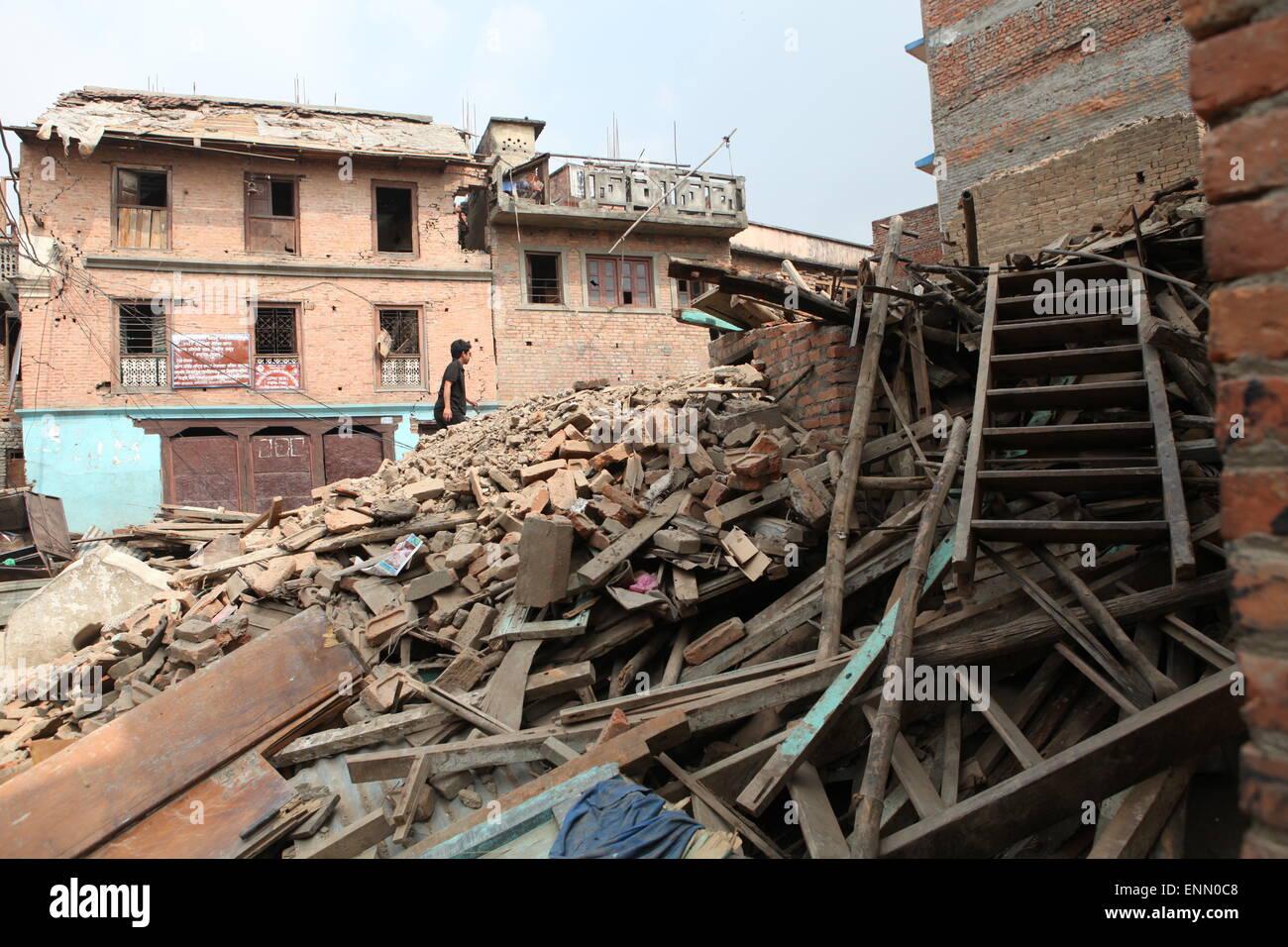 Kathmandu, Nepal. 8th May, 2015. Nepali residents clear rubble and ...