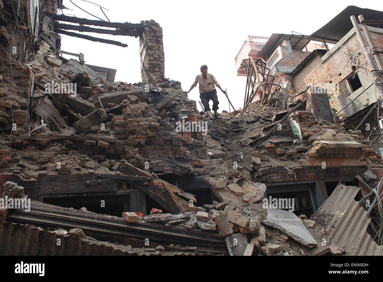 Kathmandu, Nepal. 8th May, 2015. Nepali residents clear rubble and ...