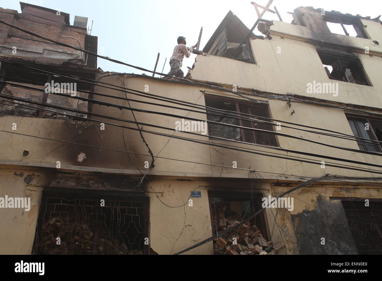 Kathmandu, Nepal. 8th May, 2015. Nepali residents clear rubble and ...