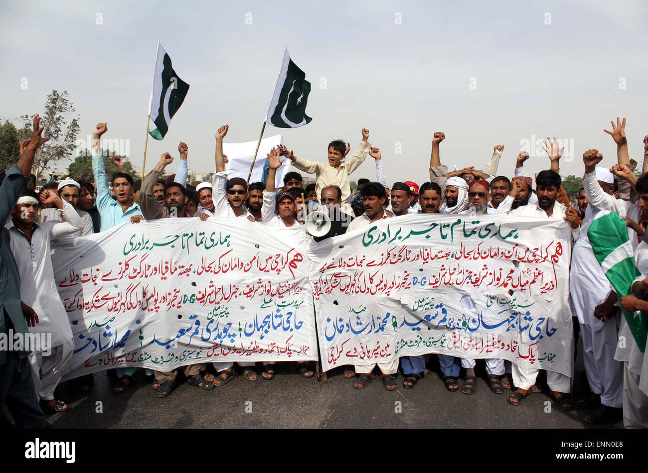 Members of Pak Ittehad Welfare Association chant slogans in favor of ...