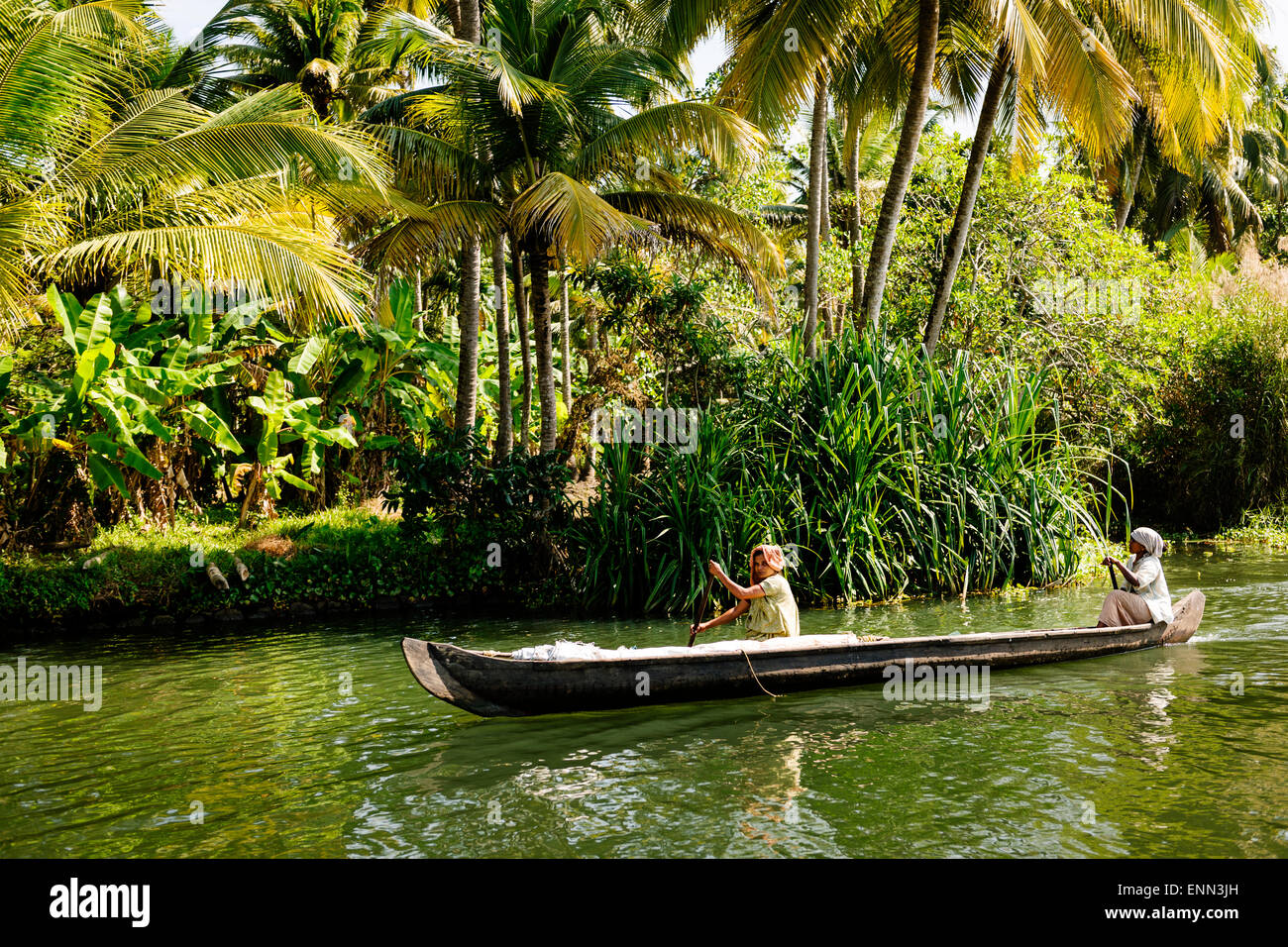 Local villagers in the Kerala Backwaters getting around in a ...