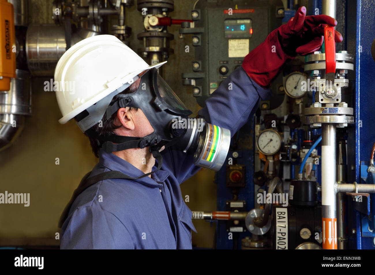 worker at a dangerous operation in a chemical industry Stock Photo - Alamy