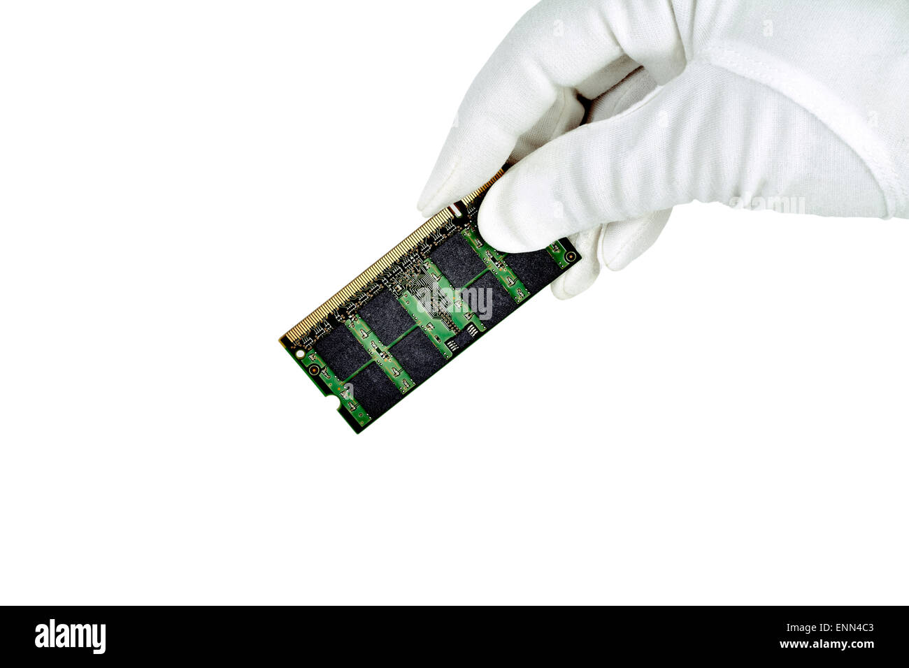 A computer memory chip held by white gloved hand isolated on white ...