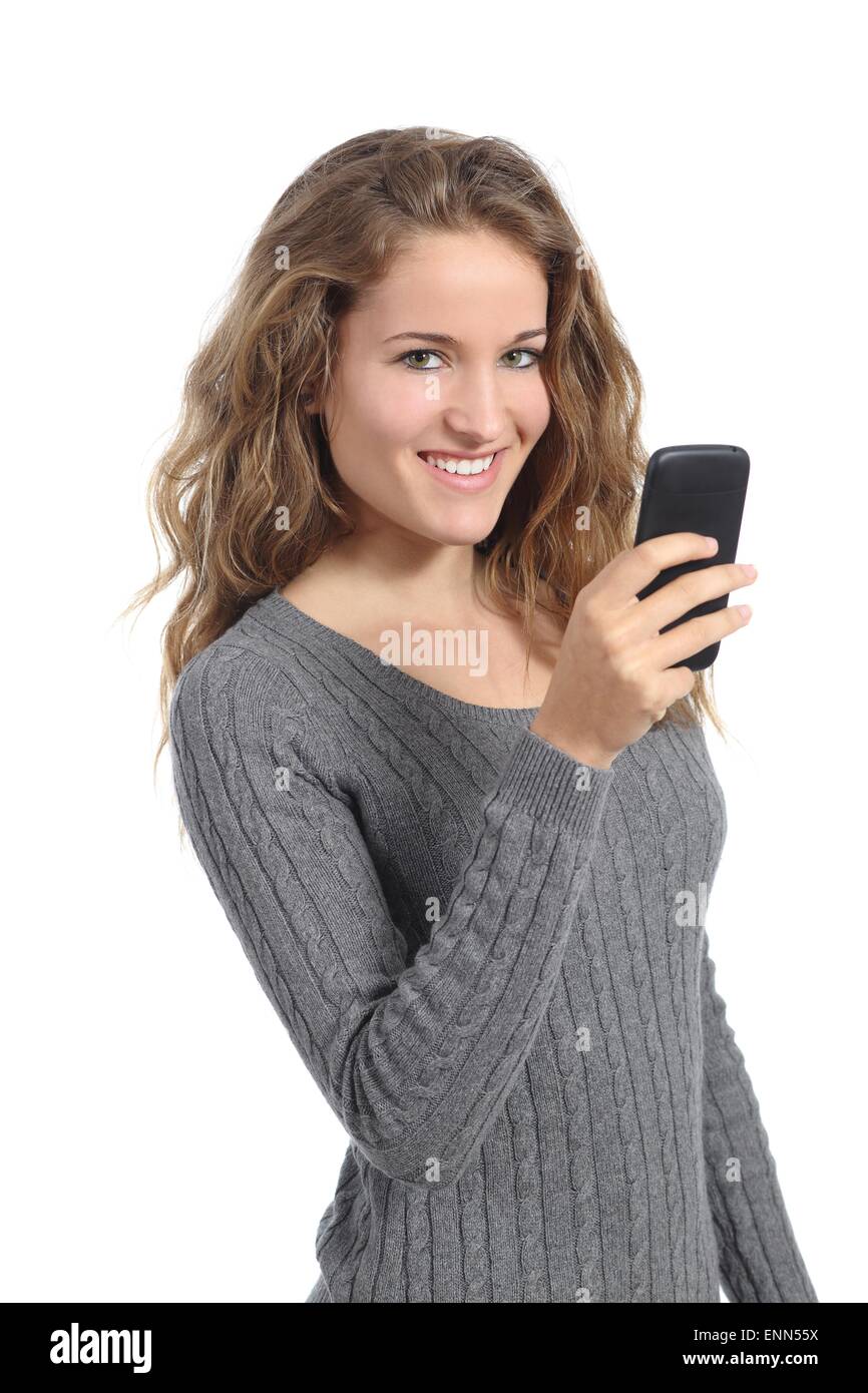 Beautiful woman texting on a mobile phone looking at camera isolated on ...