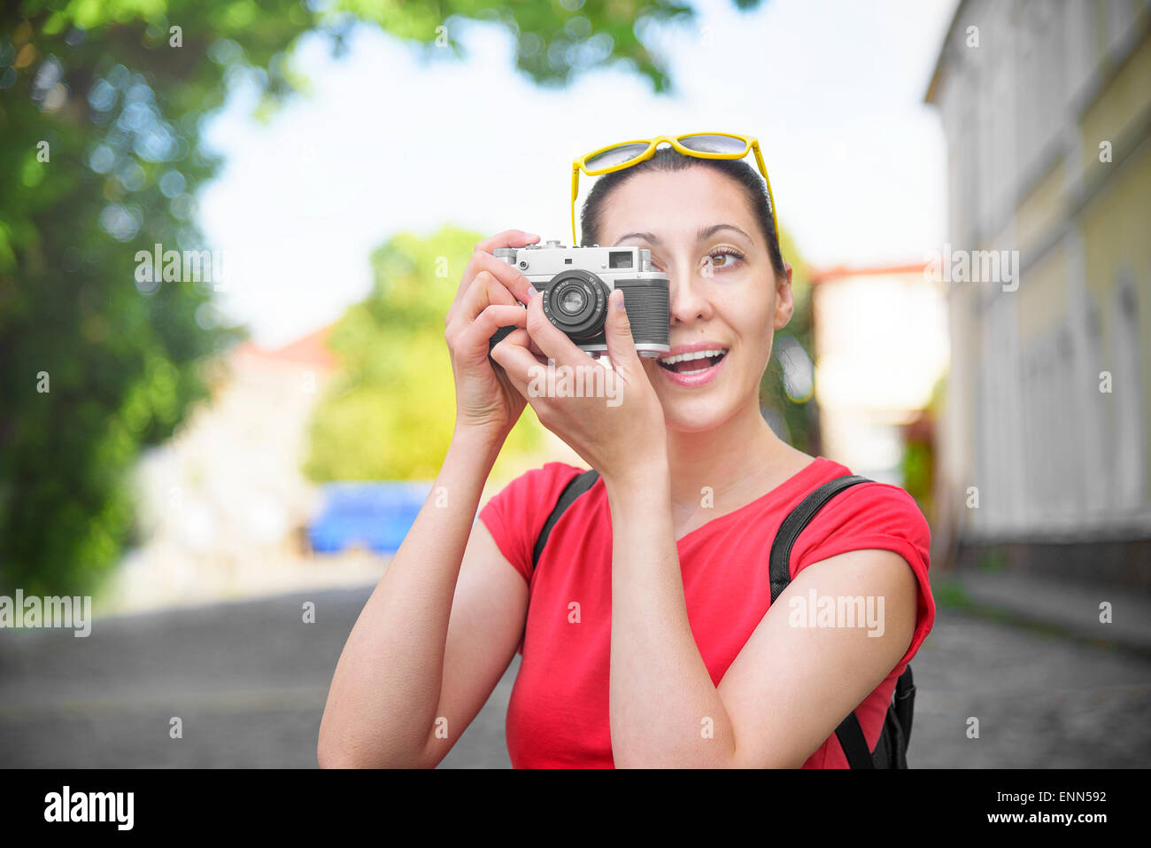 Tourist girl using camera Stock Photo - Alamy
