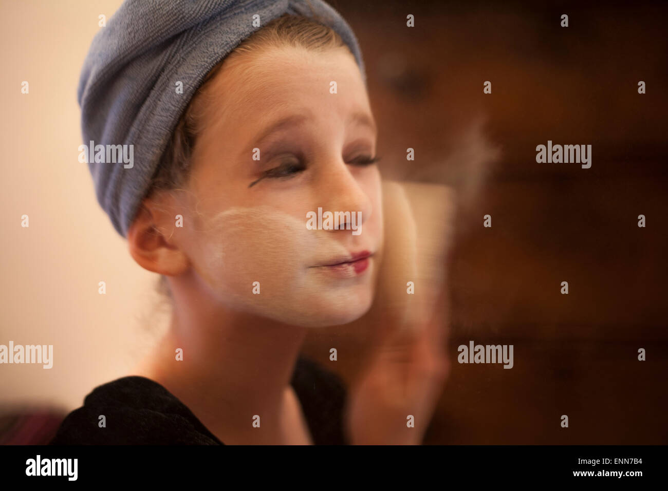 Young girl playing with make-up Stock Photo - Alamy